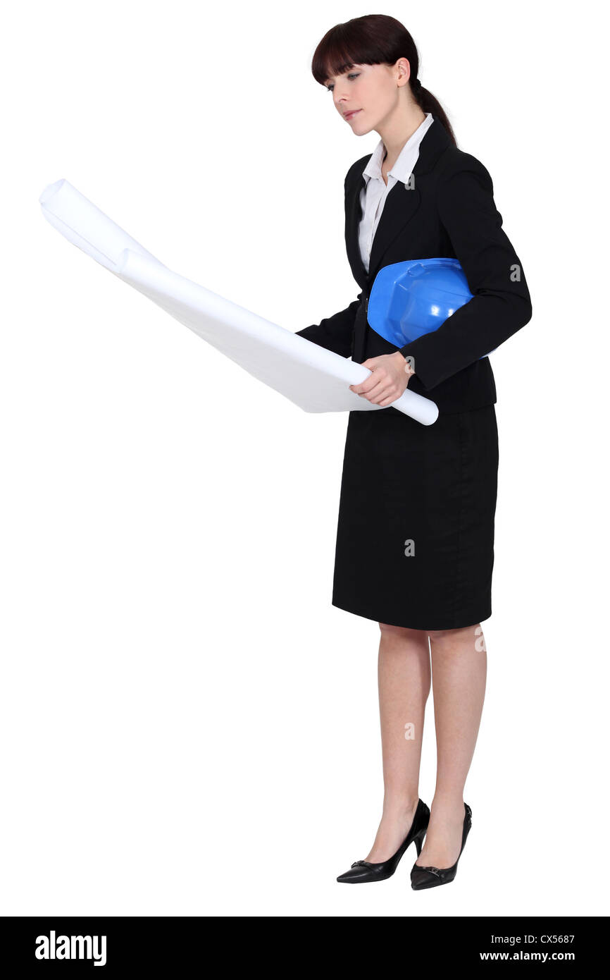 businesswoman looking at blueprint Stock Photo - Alamy