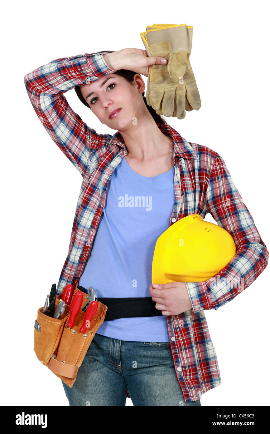 Tired female builder Stock Photo - Alamy