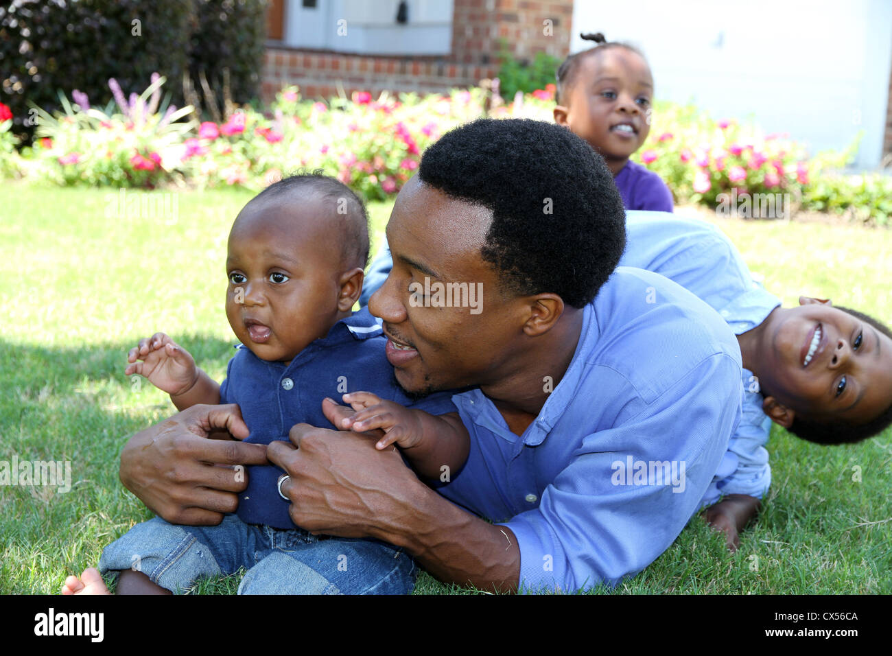 African American family together outside their home Stock Photo - Alamy