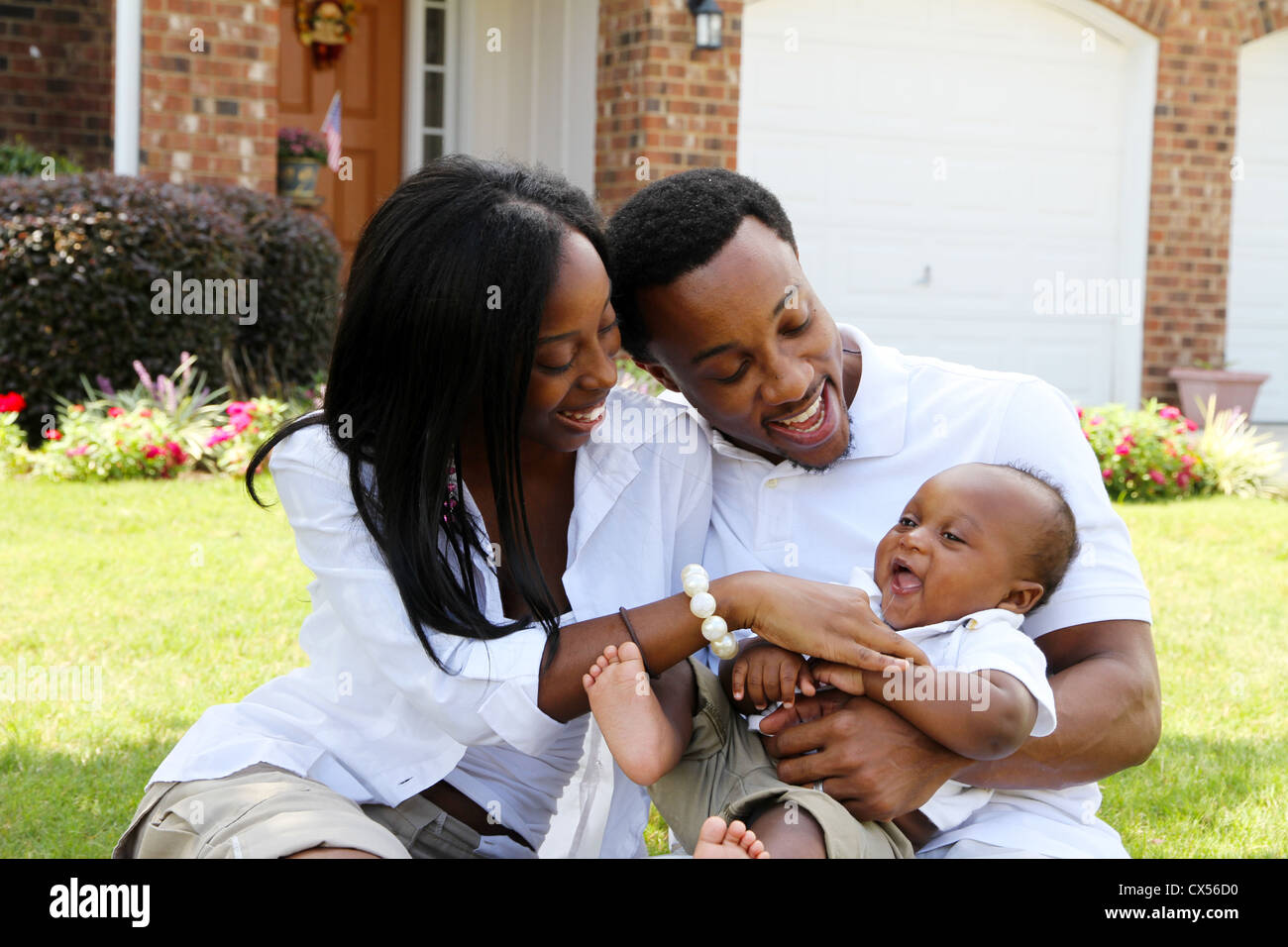 African American family together outside their home Stock Photo - Alamy