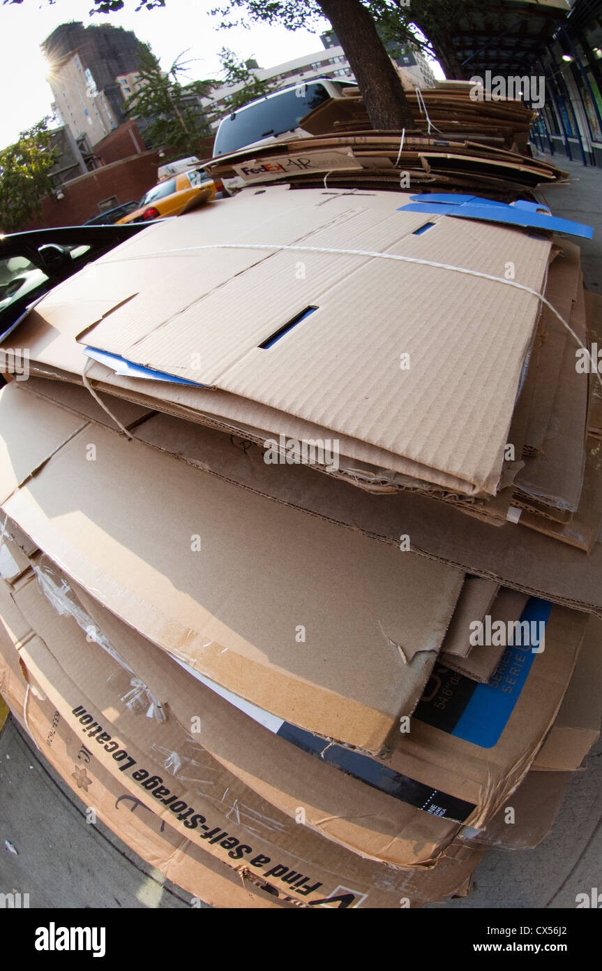 Cardboard in residential trash bundled for pick up and recycling on ...