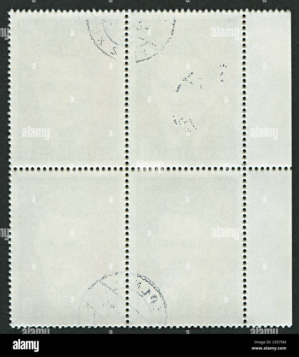 The reverse side of a postage stamp Stock Photo - Alamy
