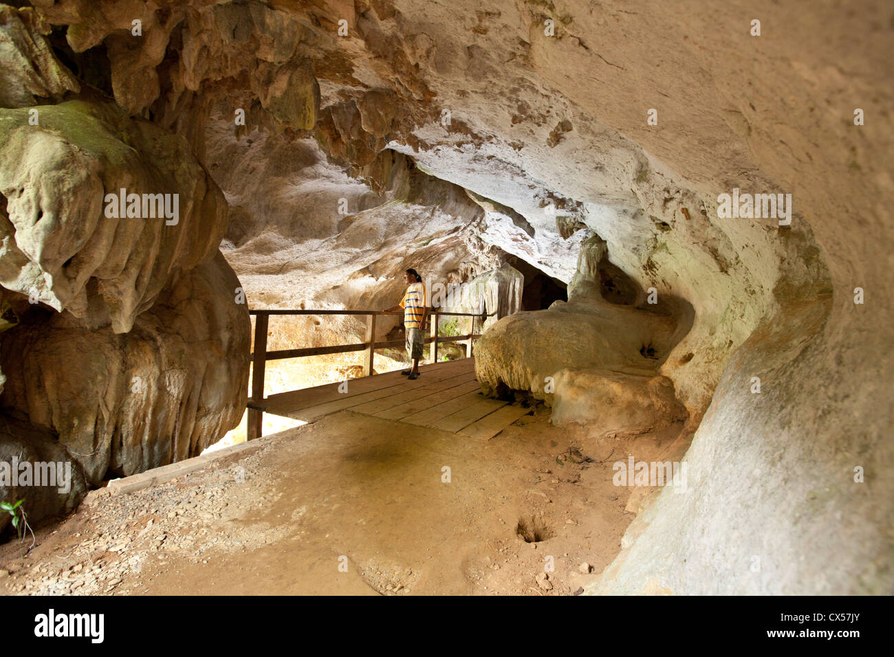 Man hiking through cave in the Cayo District in Central America, Belize ...
