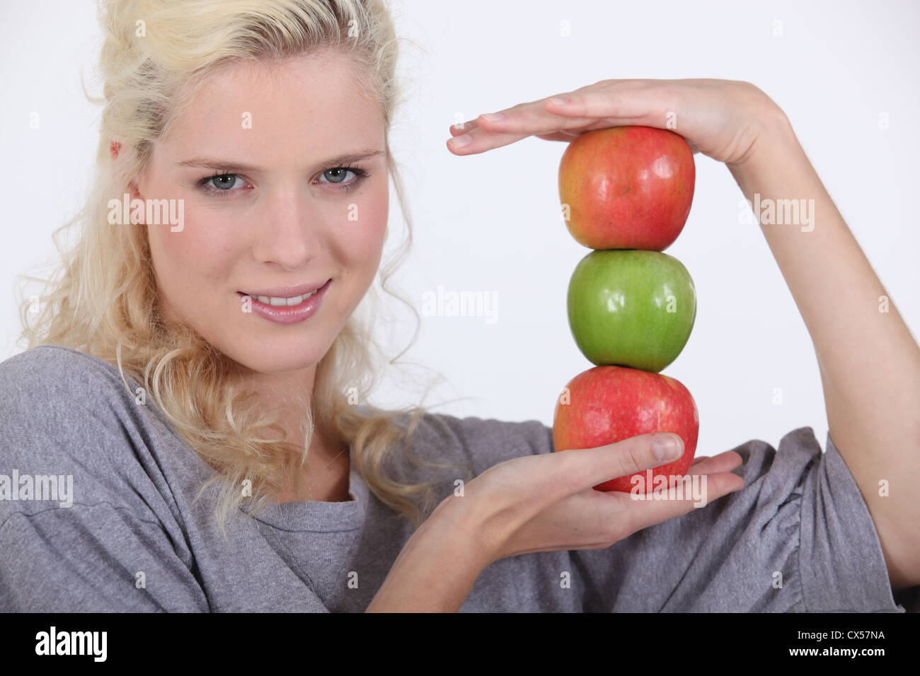 Woman with apple Stock Photo - Alamy