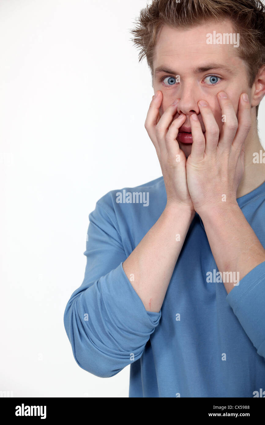 Shocked man on white background Stock Photo - Alamy