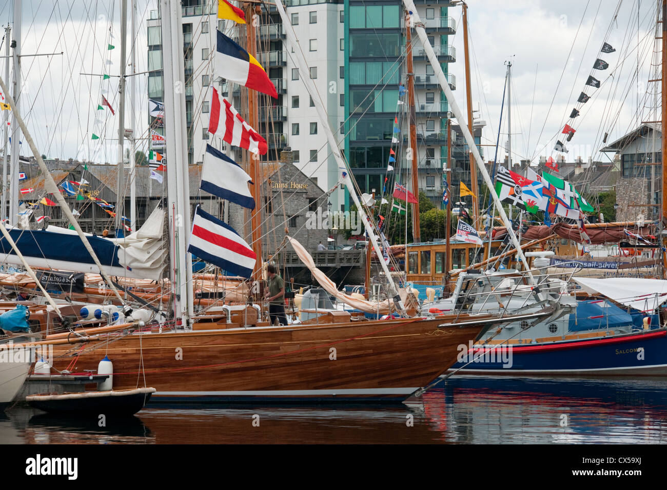 Old wooden sailing vessels bedecked and festooned in flags and bunting ...