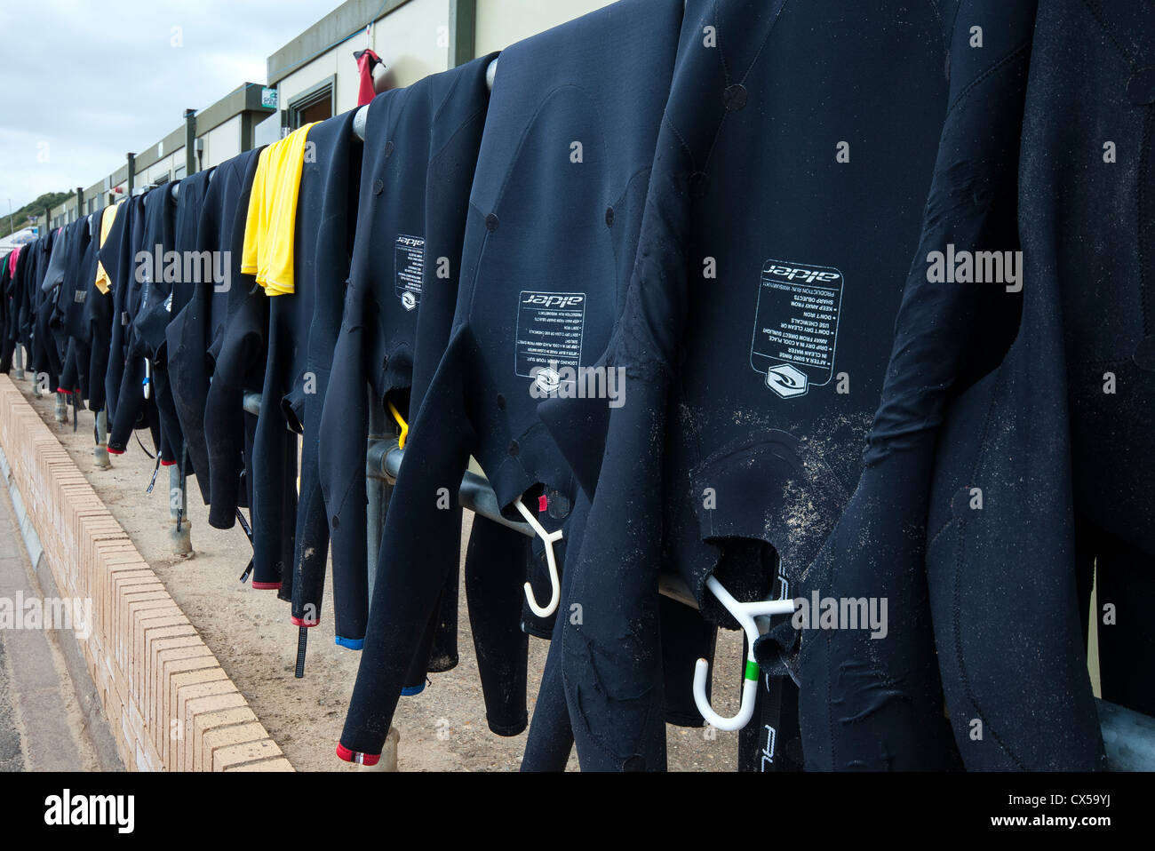 Wetsuit drying hi-res stock photography and images - Alamy