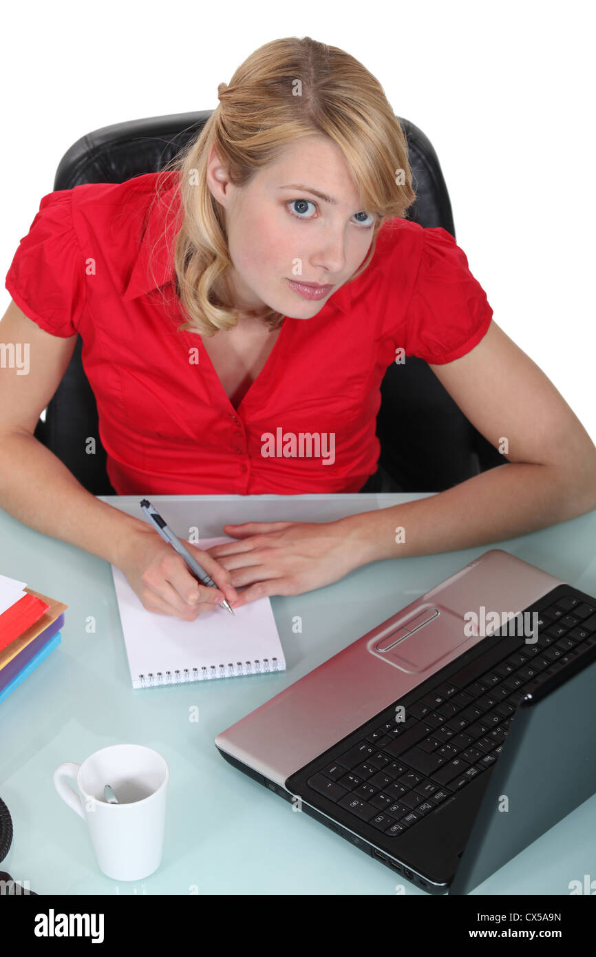 Secretary working at her desk Stock Photo - Alamy