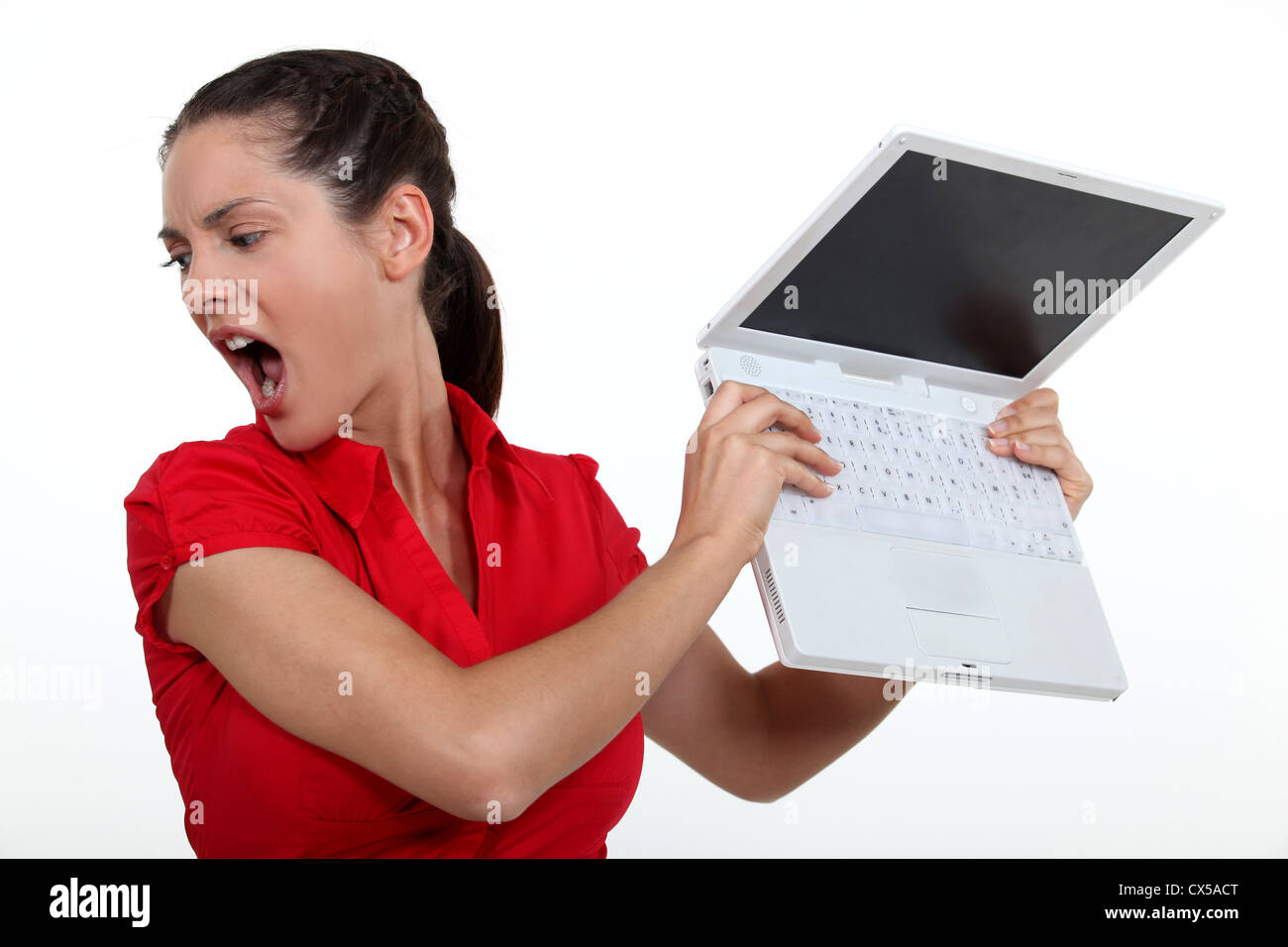 Women breaking computer Stock Photo - Alamy