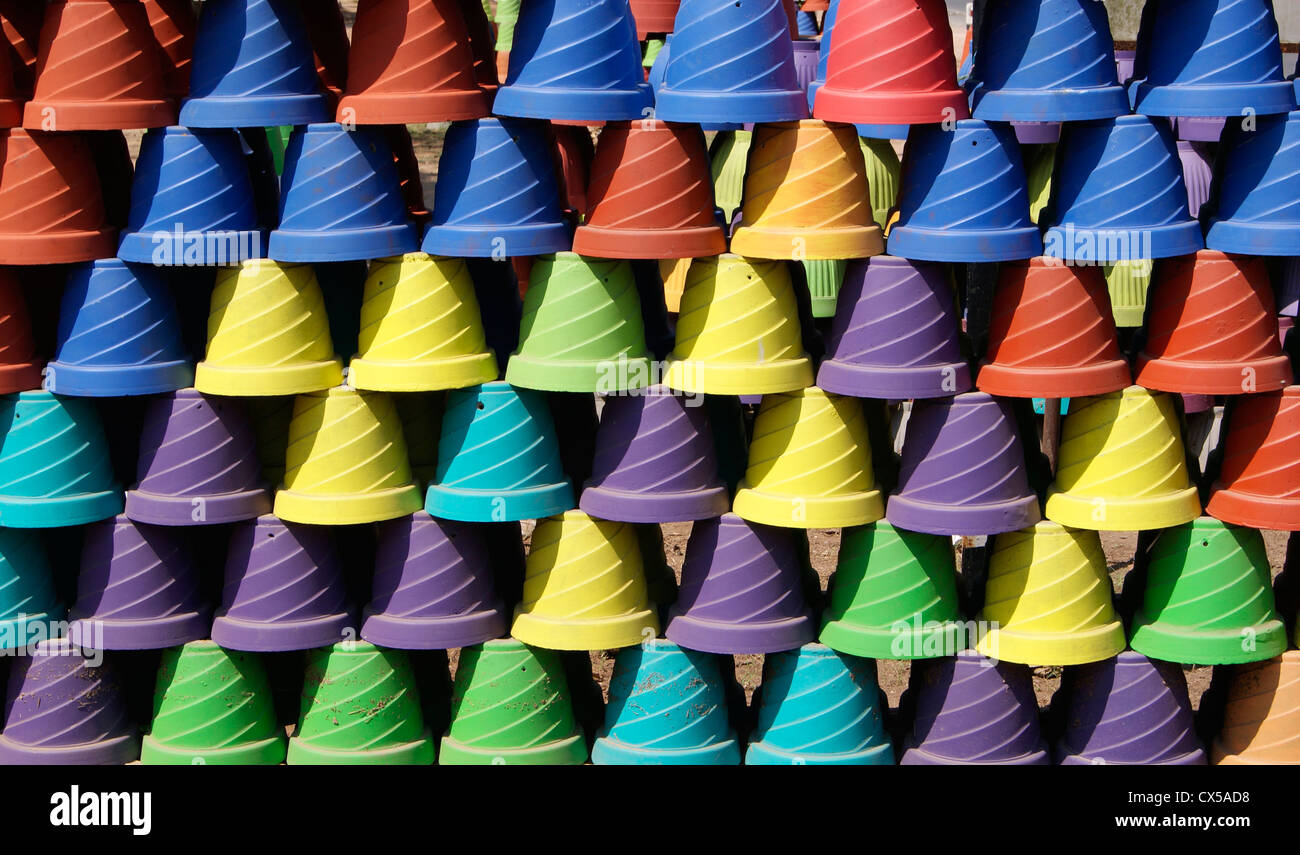 Different color Clay Pots Arranged one above one for Flower Pot Sales ...