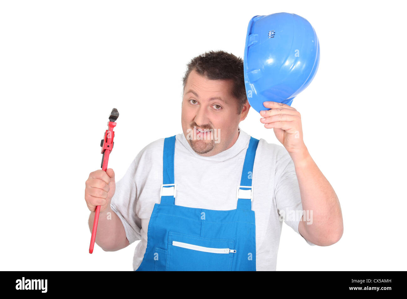 Jolly plumber with a pipe wrench Stock Photo - Alamy