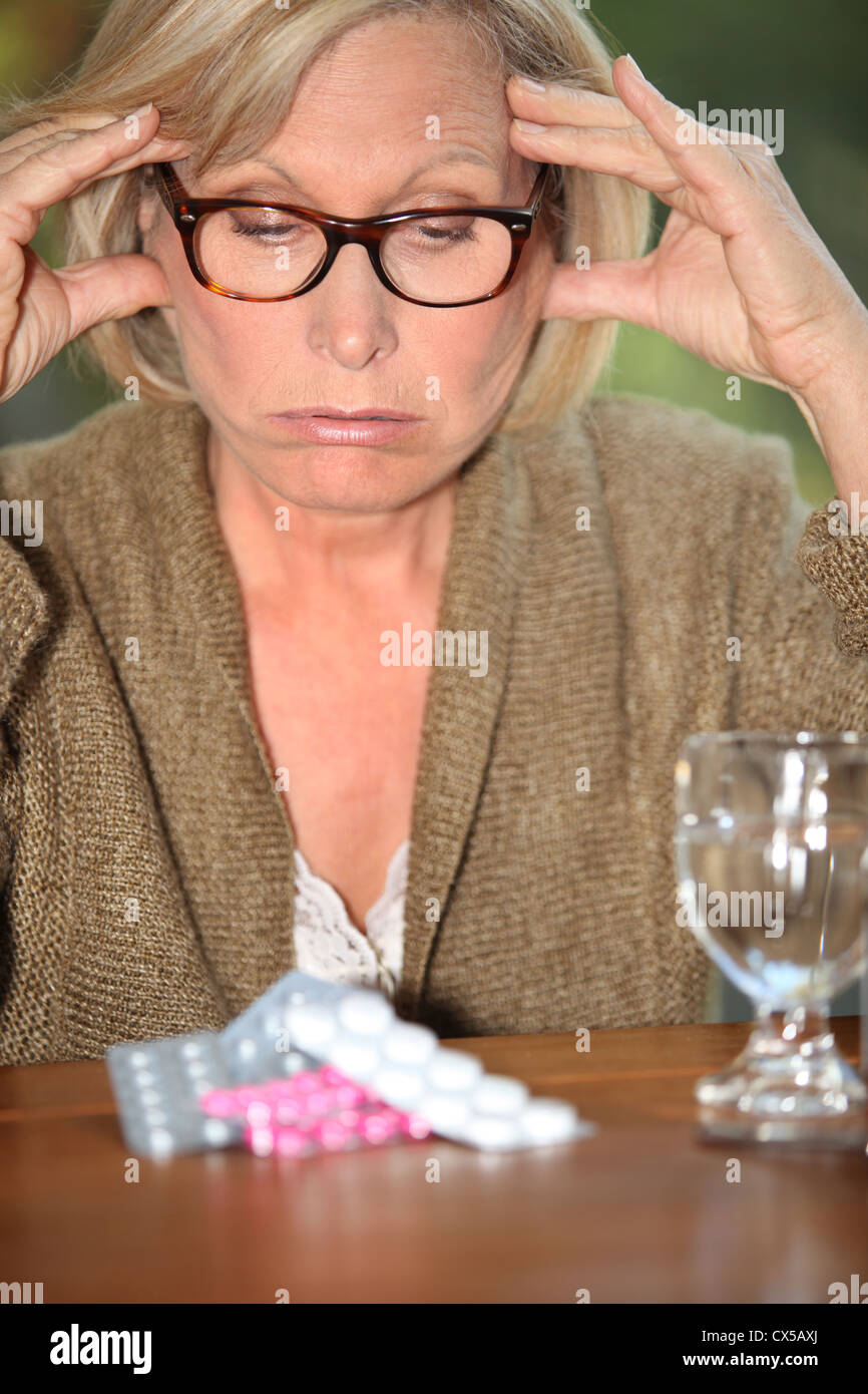 senior lady taking too much pills Stock Photo - Alamy