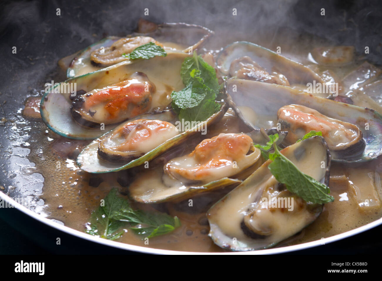 fresh mussels cooking in frying pan Stock Photo - Alamy