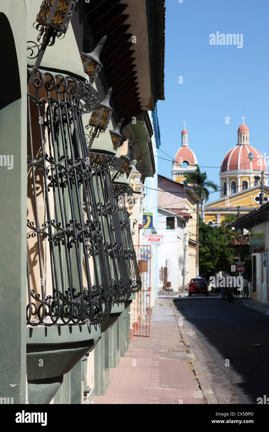 Ornate windows in street overlooked by Cathedral of Granada Cruz ...