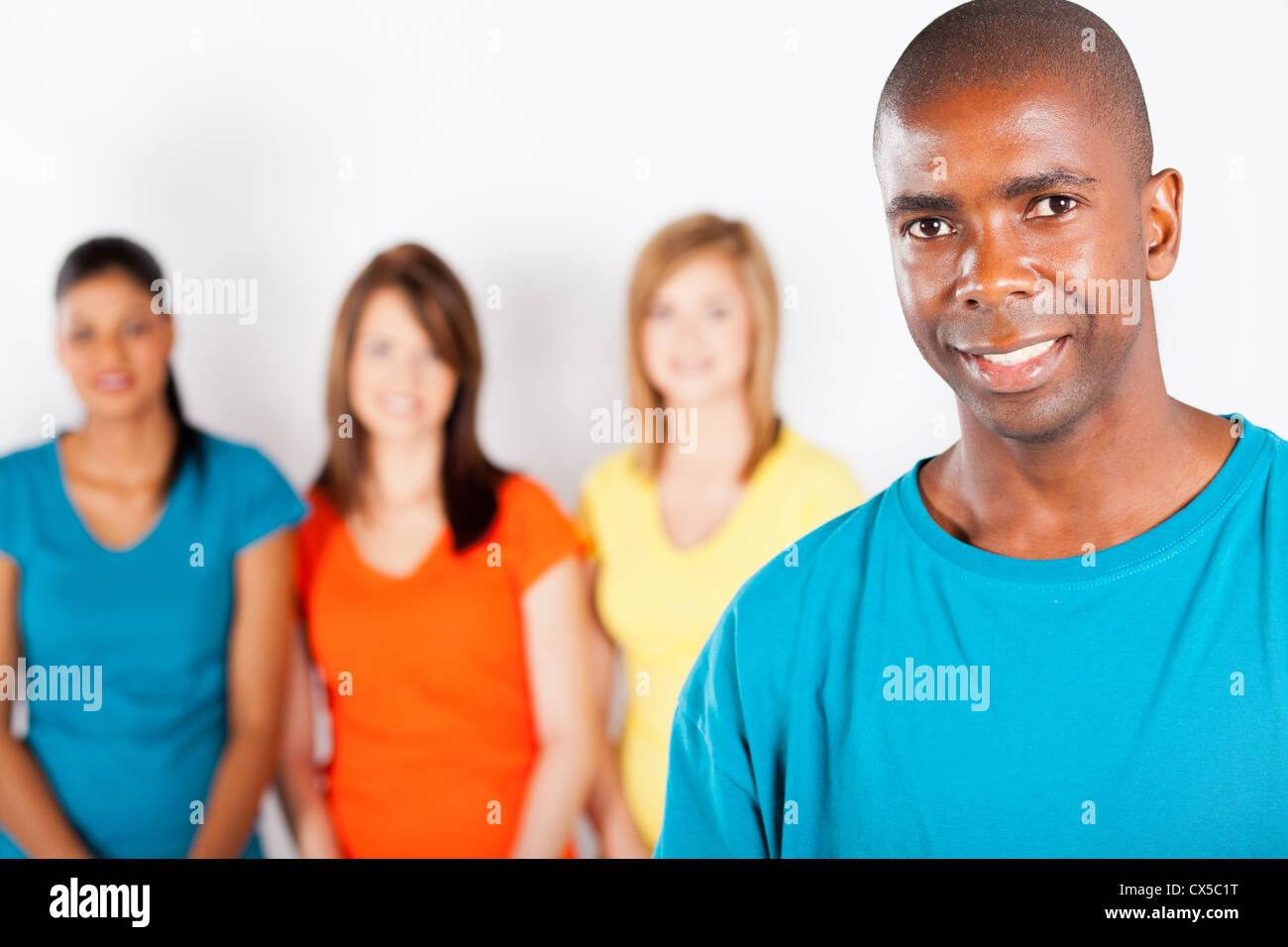 young African American man standing in front of group of girls Stock ...