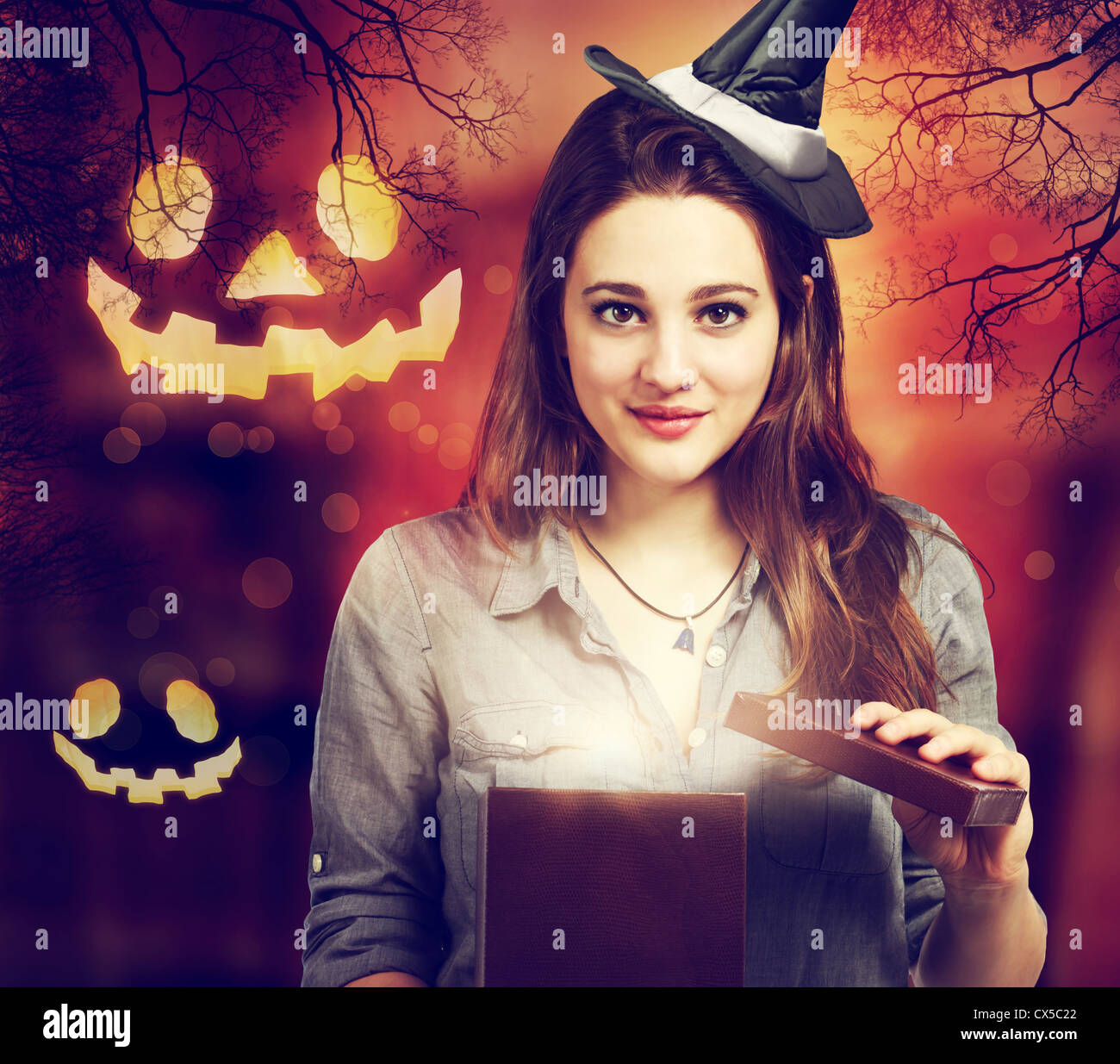 Cute Halloween Witch Opening a Box Stock Photo - Alamy