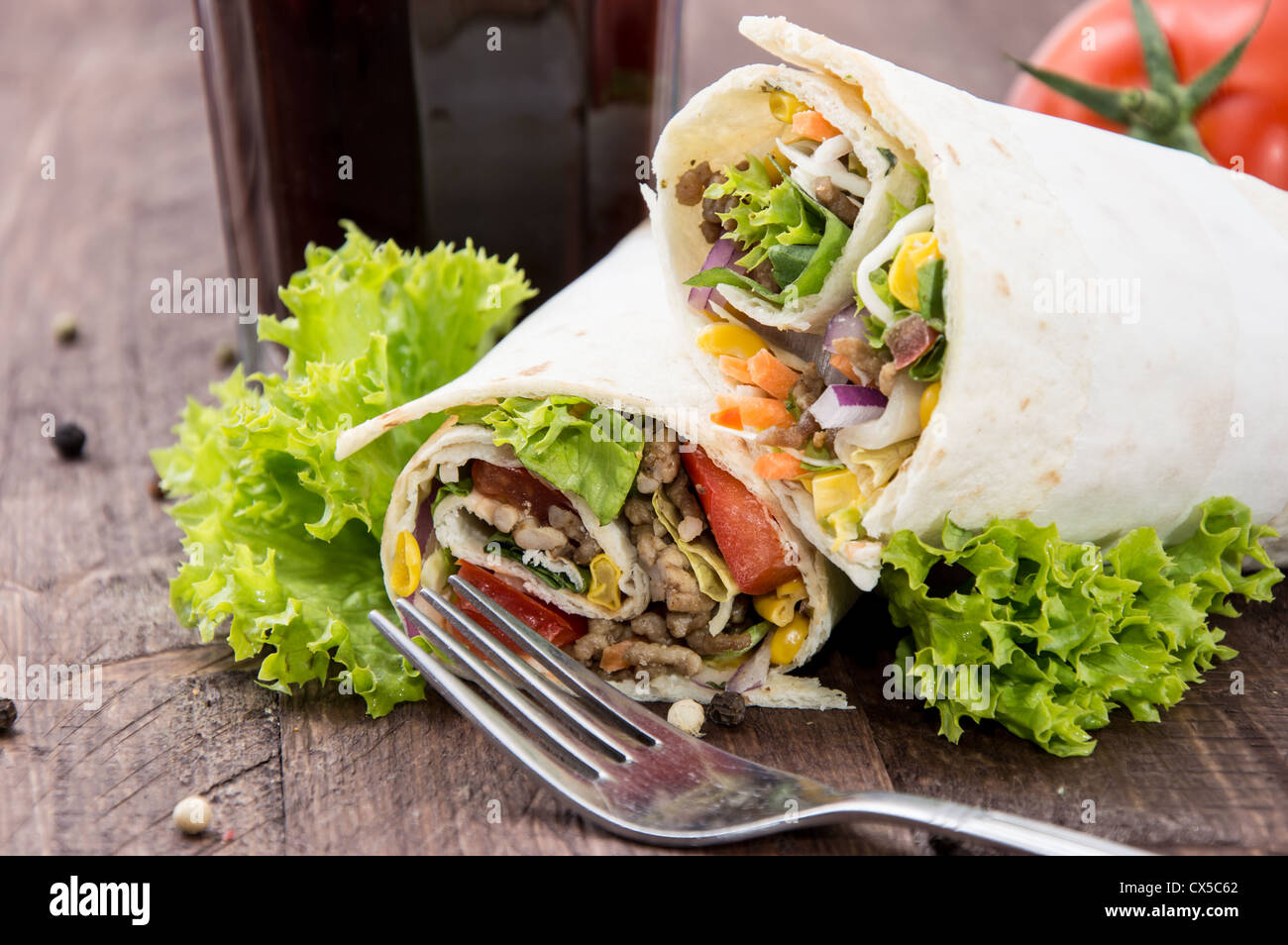 Heap of Wraps on wooden background Stock Photo - Alamy