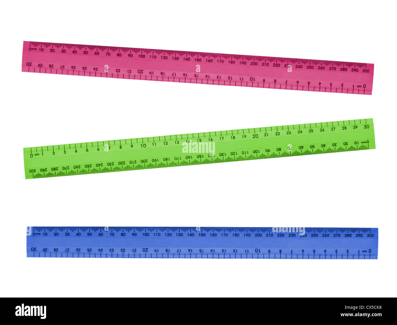 A metal ruler isolated against a white background Stock Photo - Alamy
