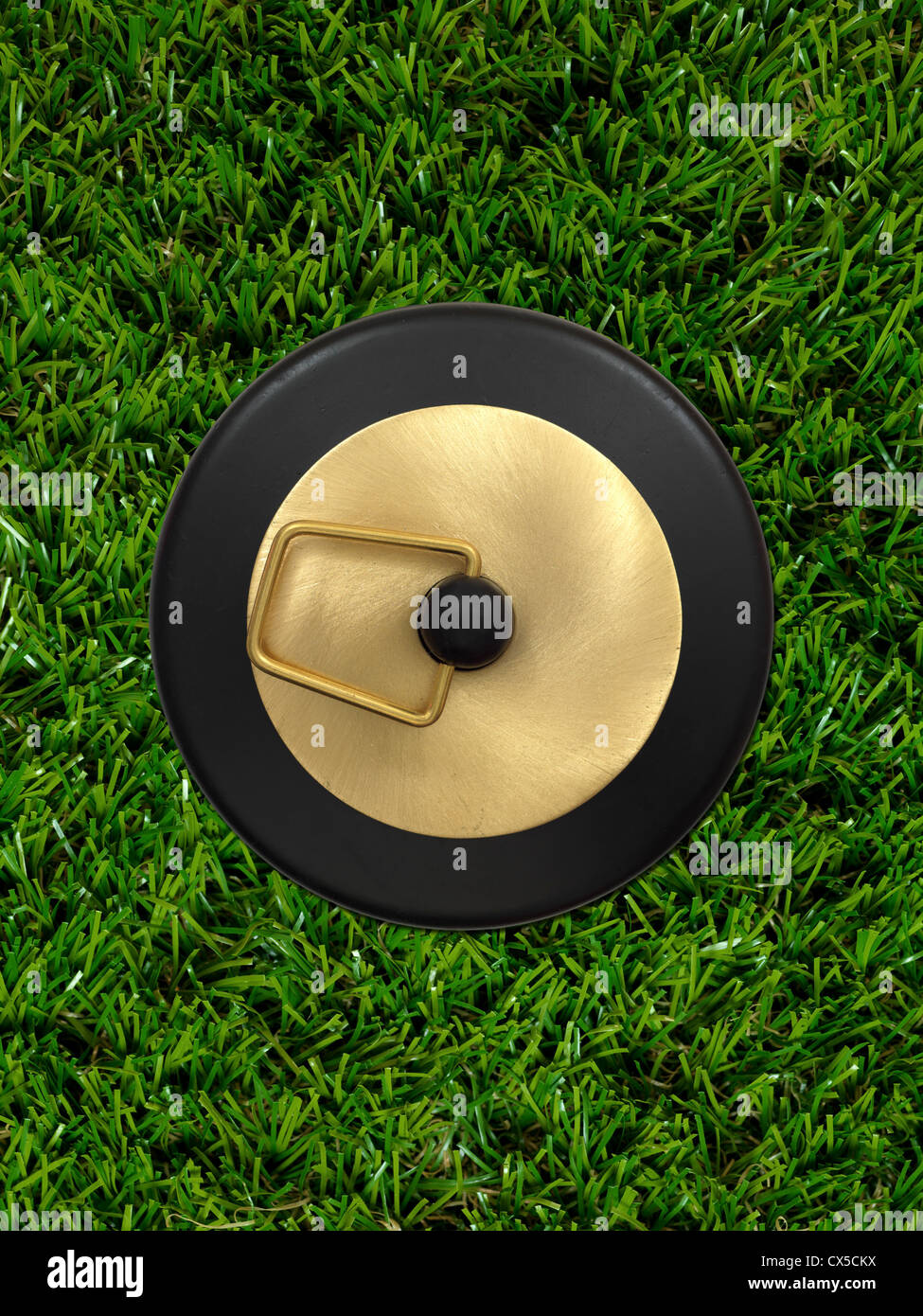 A close up image of a drain hole plug Stock Photo - Alamy