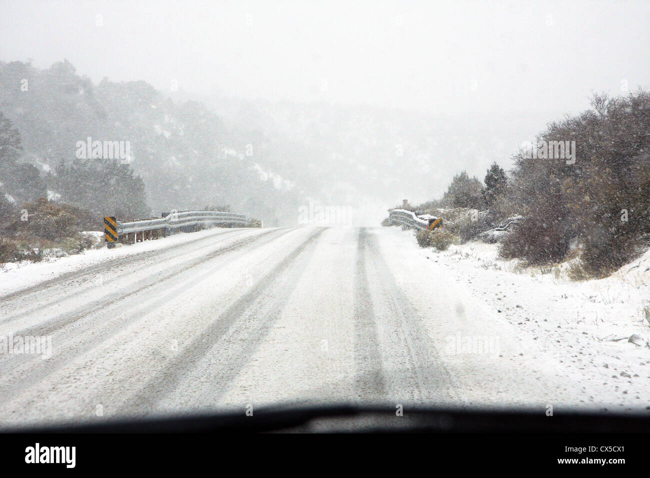 look out of the windshield of a car driving on a snow road Stock Photo ...