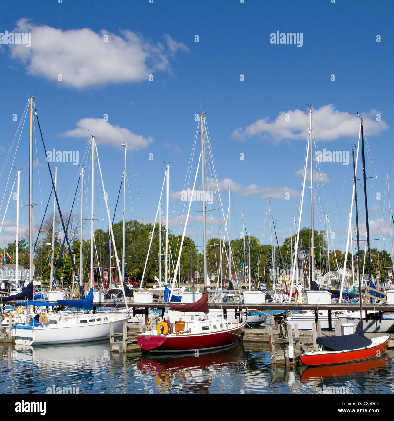 Square photo of sailboats docked in the marina Stock Photo - Alamy