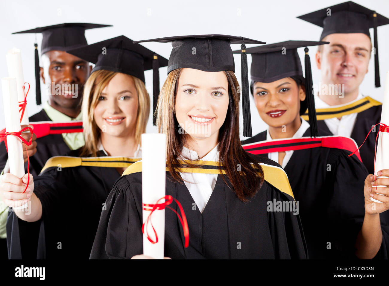 group of graduates in graduation gown and cap Stock Photo - Alamy
