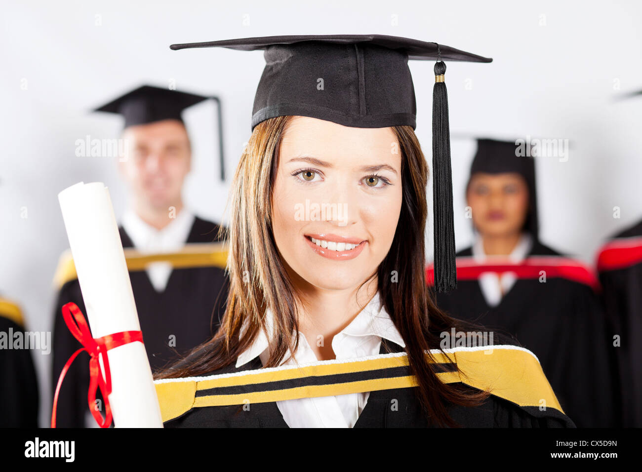 beautiful female university student at graduation with classmates Stock ...