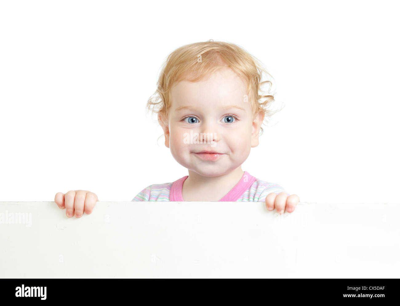Curly cute child face holding blank advertising banner Stock Photo - Alamy
