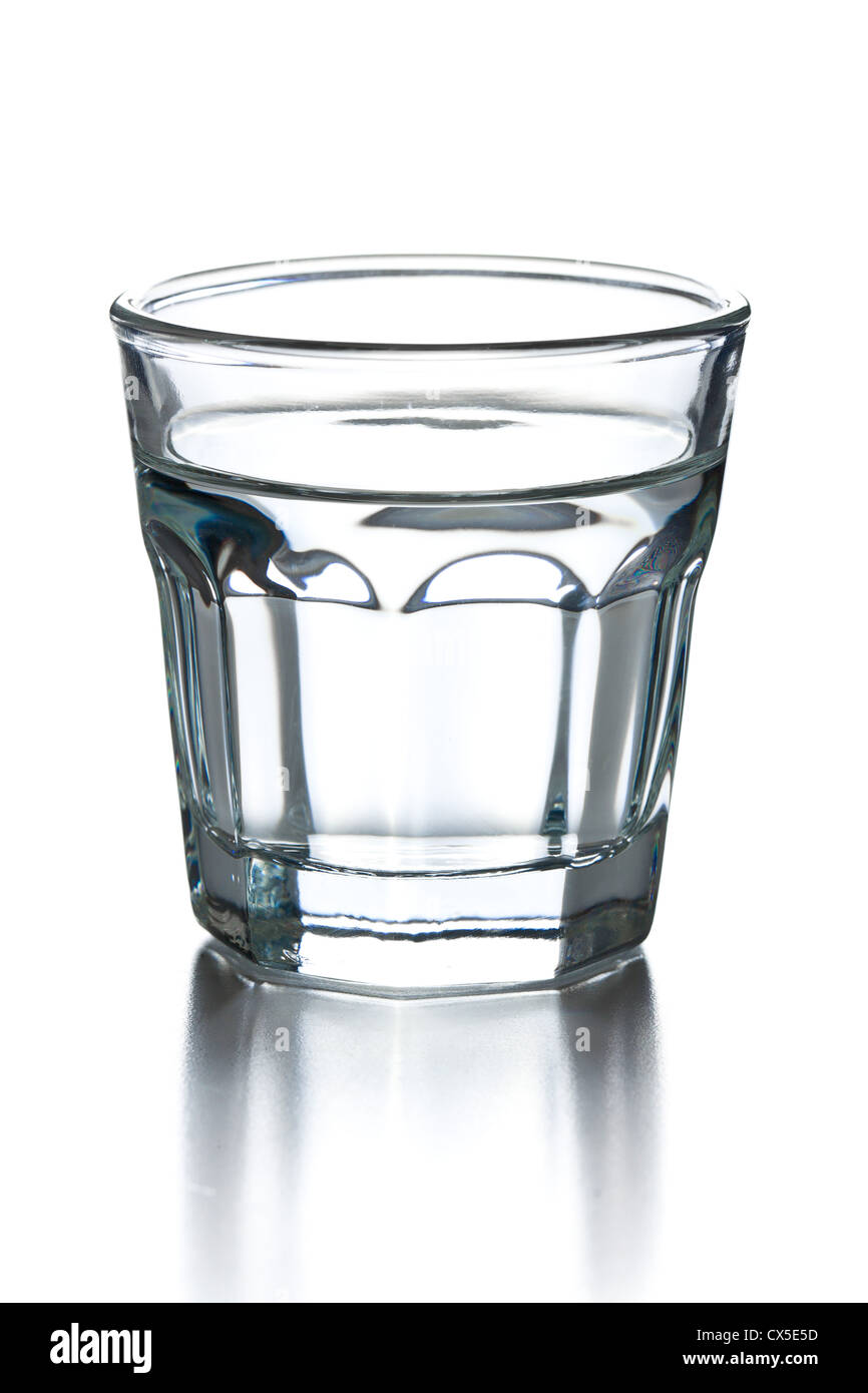 glass of clear alcohol on white background Stock Photo - Alamy