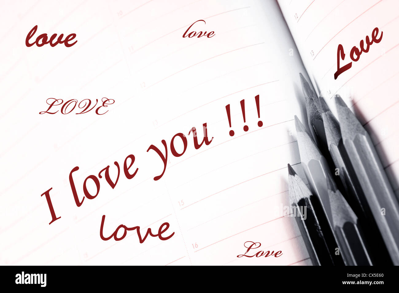Love message on a white paper Stock Photo - Alamy