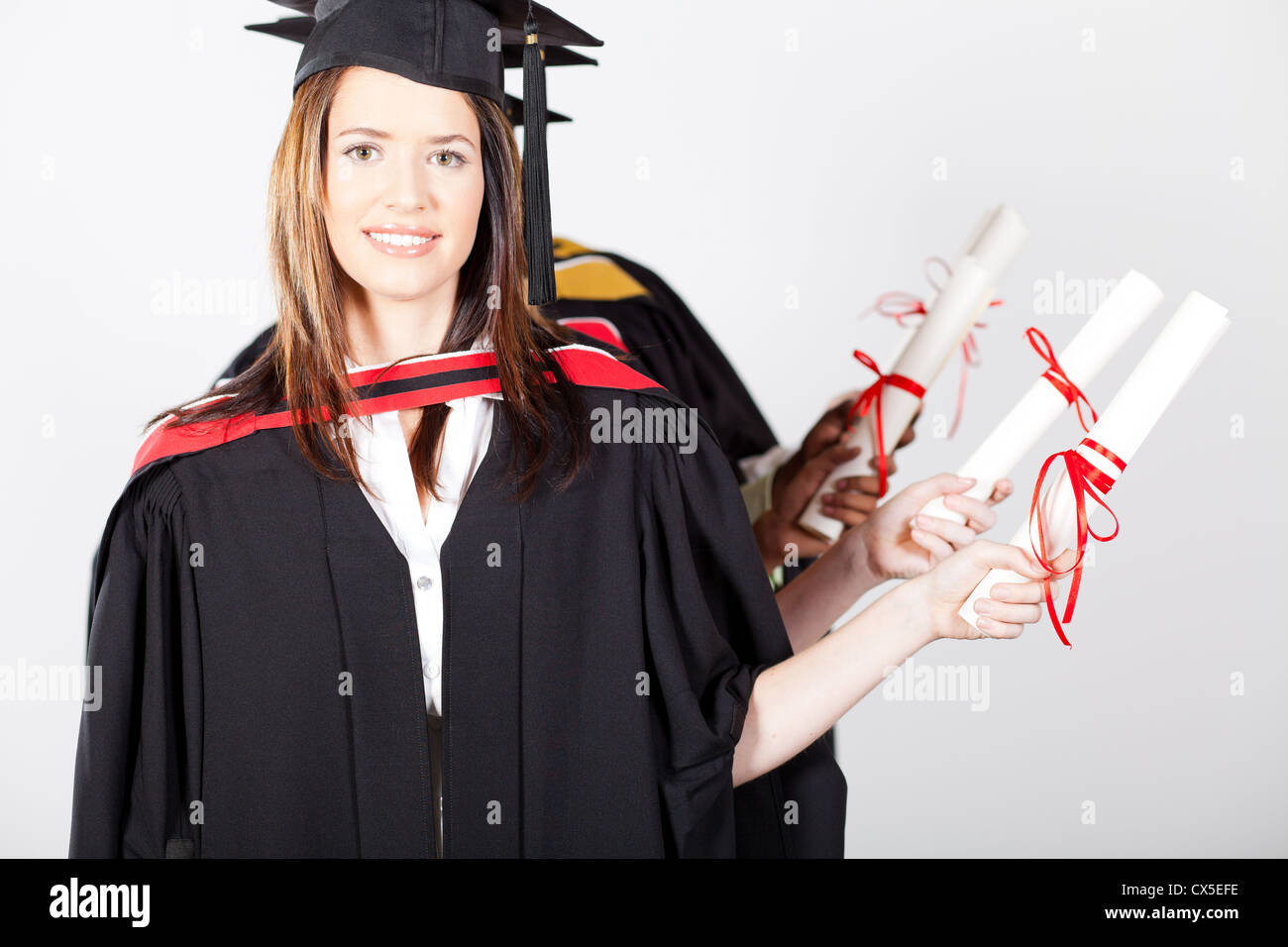 graduates holding diploma at graduation Stock Photo - Alamy