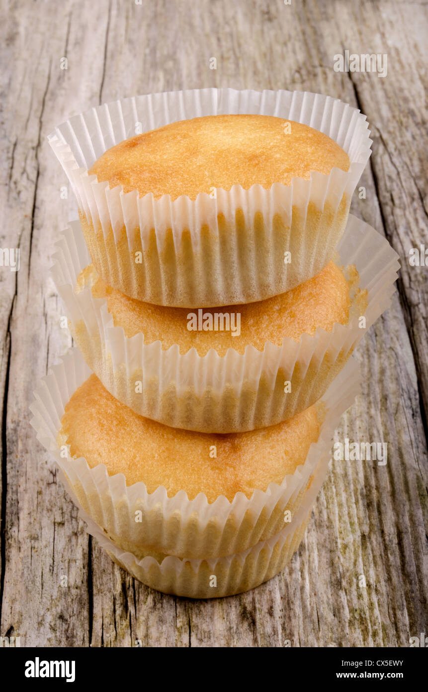 home made cup cakes on a timber board Stock Photo - Alamy