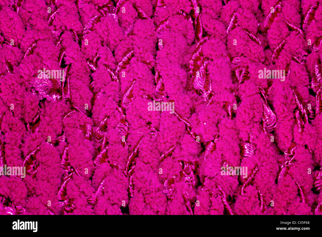 Purple red knitted yarn background closeup Stock Photo - Alamy