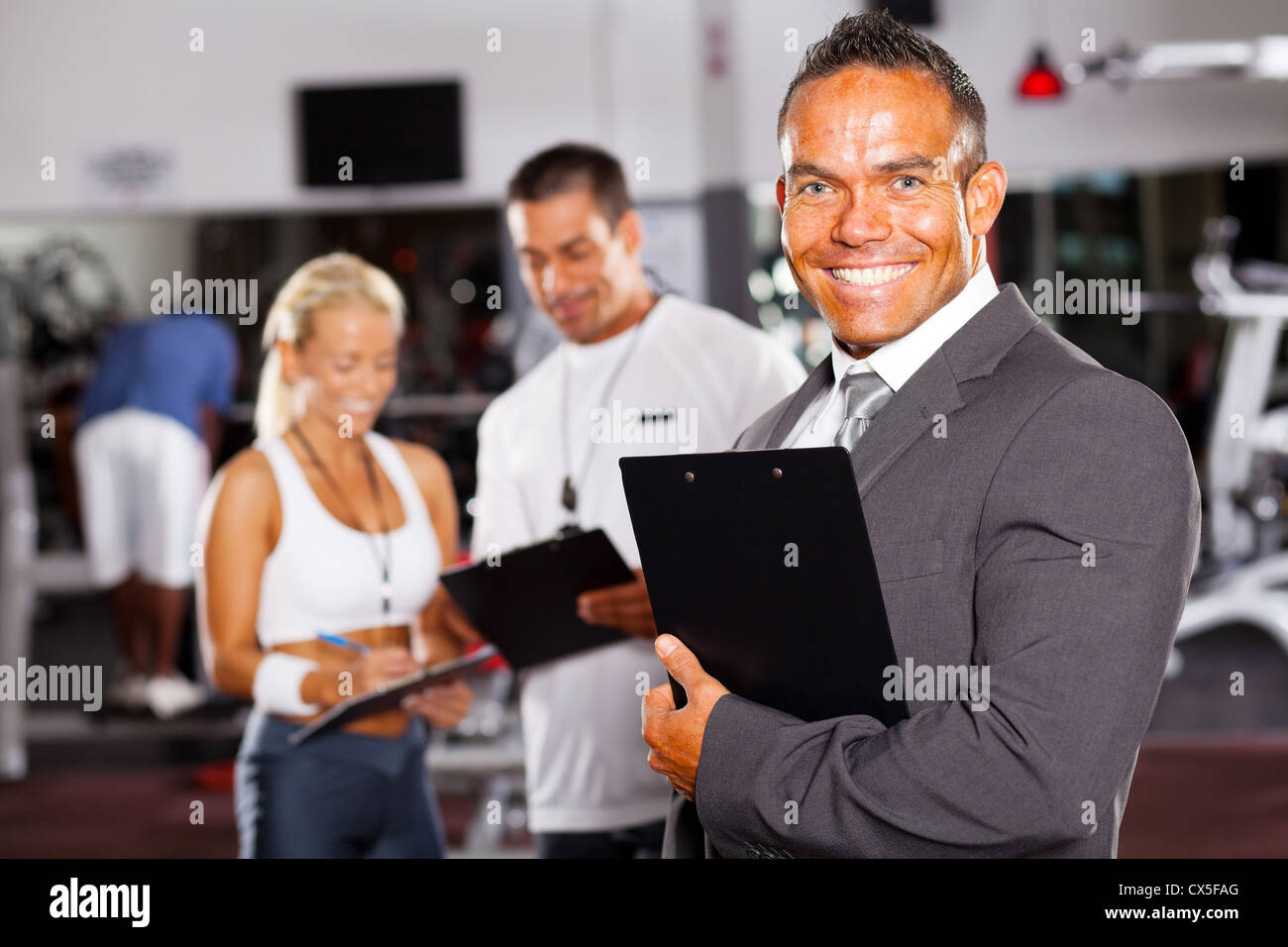 confident gym manager and staff Stock Photo - Alamy