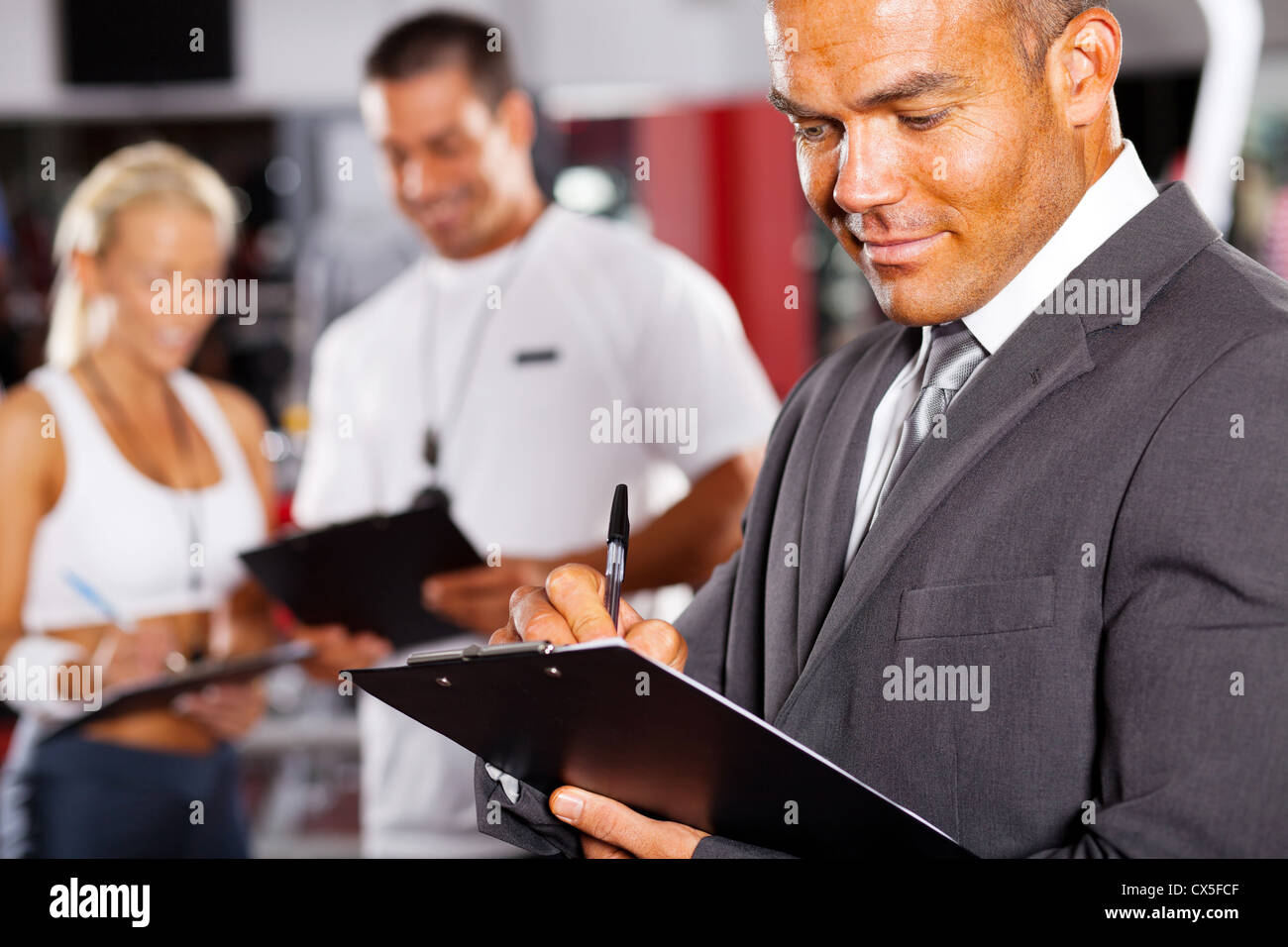 closeup of male gym manager Stock Photo - Alamy