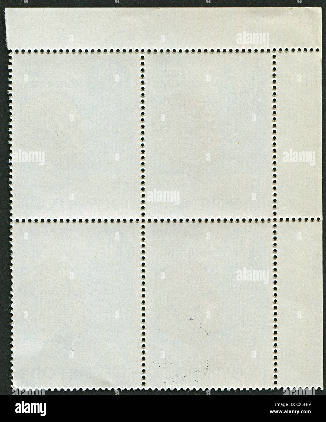 The reverse side of a postage stamp Stock Photo - Alamy