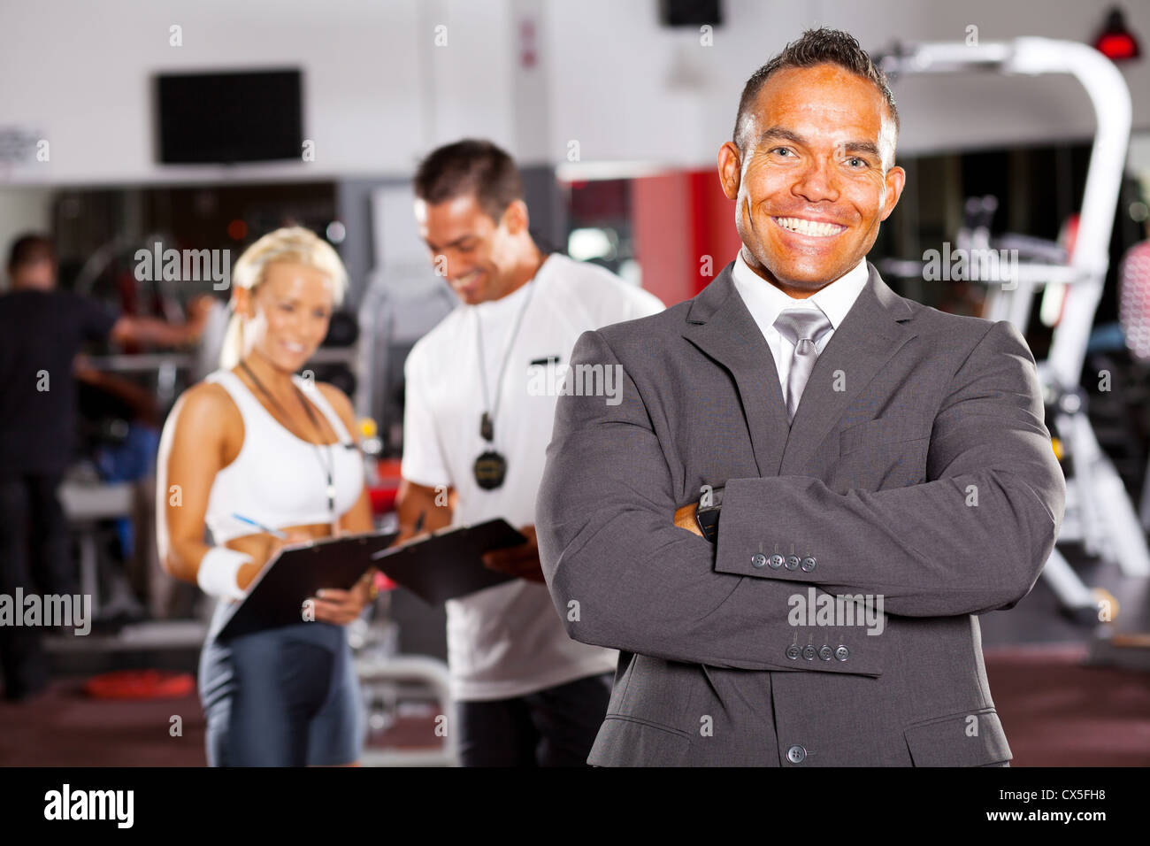 happy smiling male gym manager portrait Stock Photo - Alamy