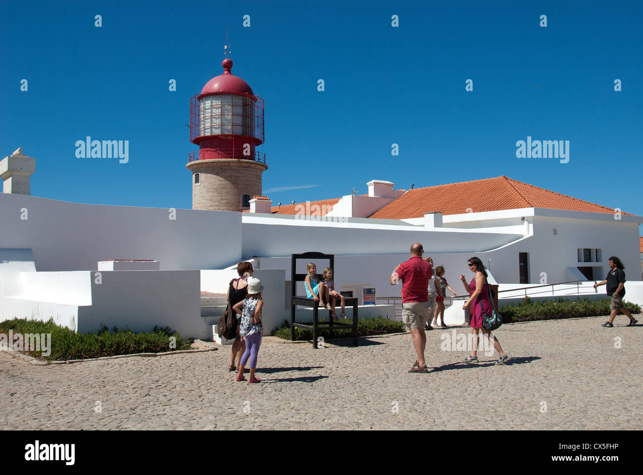 ALGARVE, PORTUGAL. Tourists at the lighthouse at Cabo de Sao Vicente ...