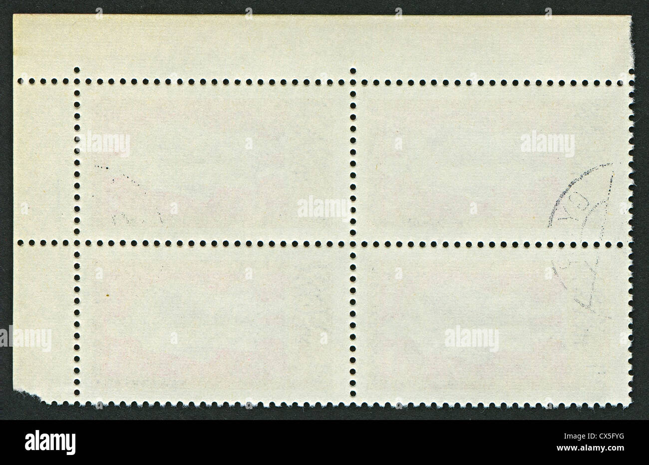 The reverse side of a postage stamp Stock Photo - Alamy