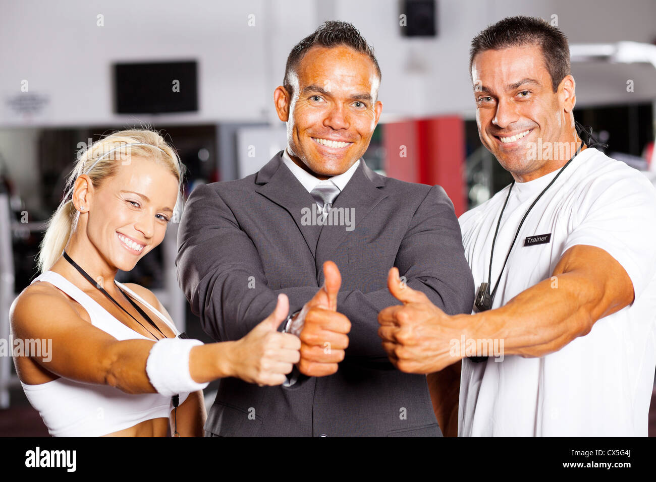 confident gym staff thumbs up Stock Photo - Alamy