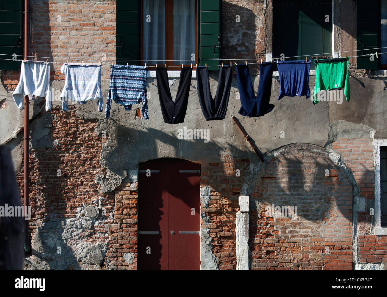 Drying clothes at the sun in italy Stock Photo - Alamy