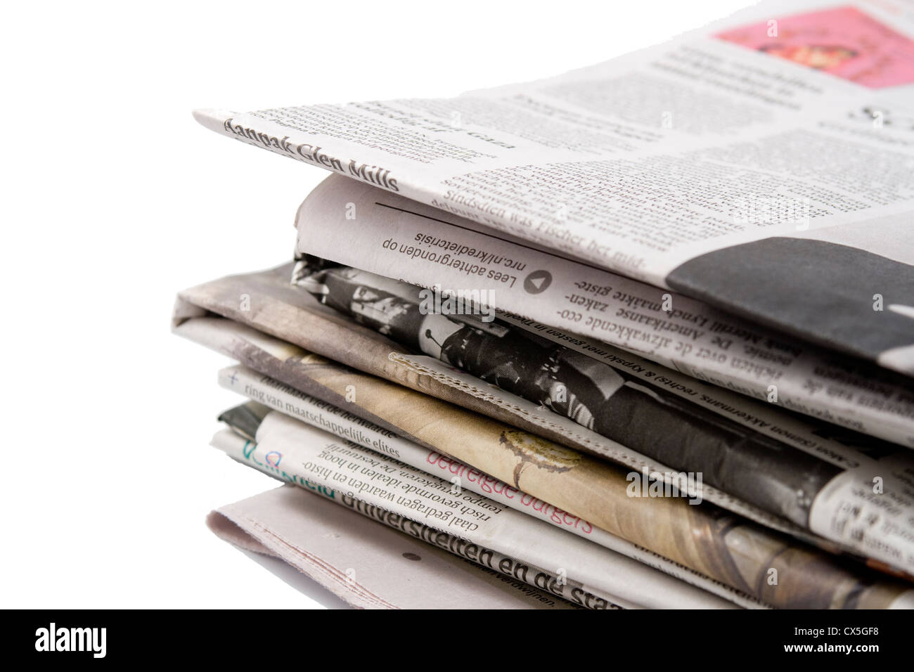 Stack of old and read newspapers Stock Photo - Alamy