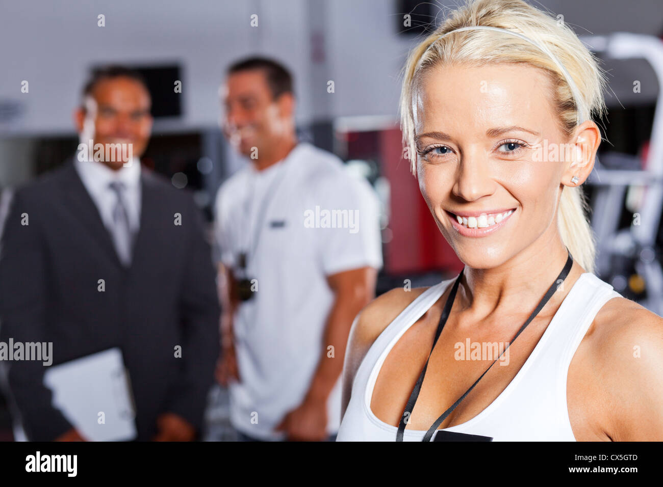 pretty female gym trainer closeup portrait Stock Photo - Alamy