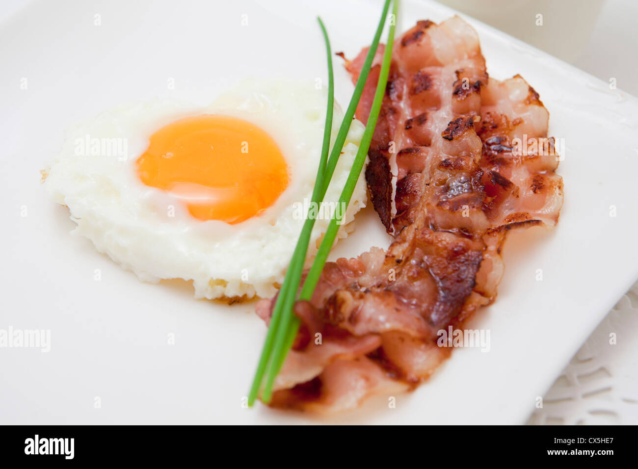 food background with fresh egg and crispy bacon Stock Photo - Alamy
