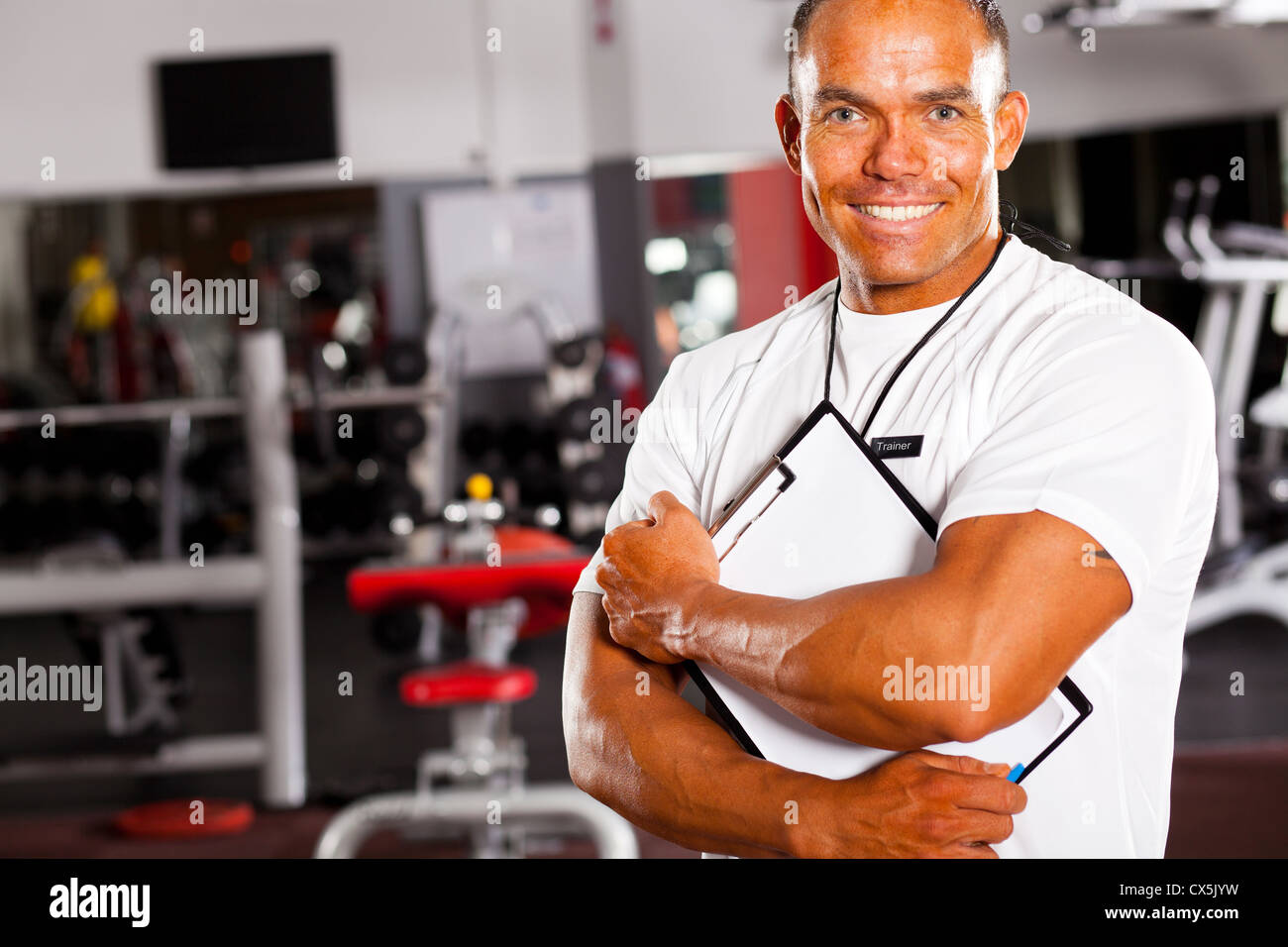 muscular male gym trainer portrait Stock Photo - Alamy