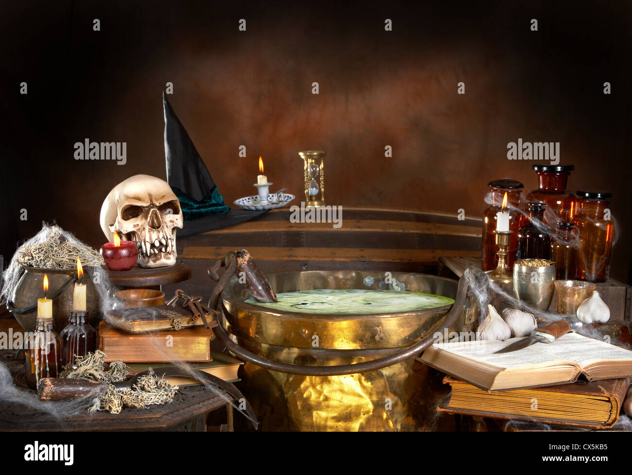 Halloween kitchen of a witch, with a cauldron full of poison soup, with ...