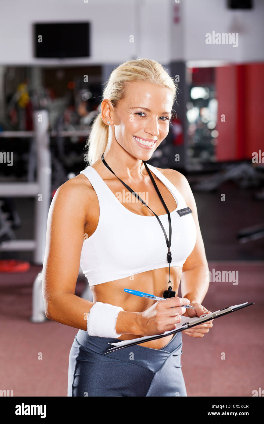happy female gym instructor portrait Stock Photo - Alamy