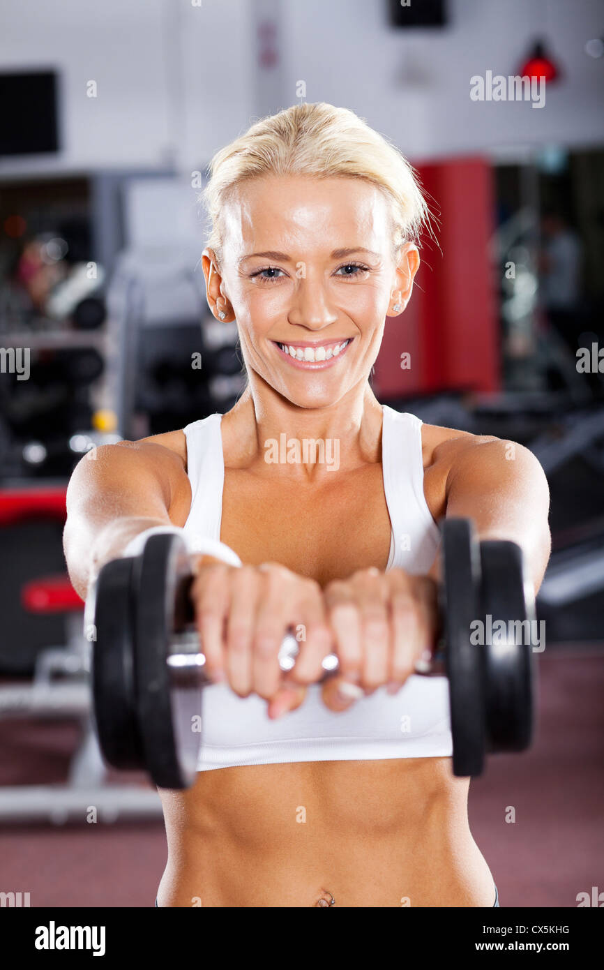 active young woman doing workout using dumbbell Stock Photo - Alamy