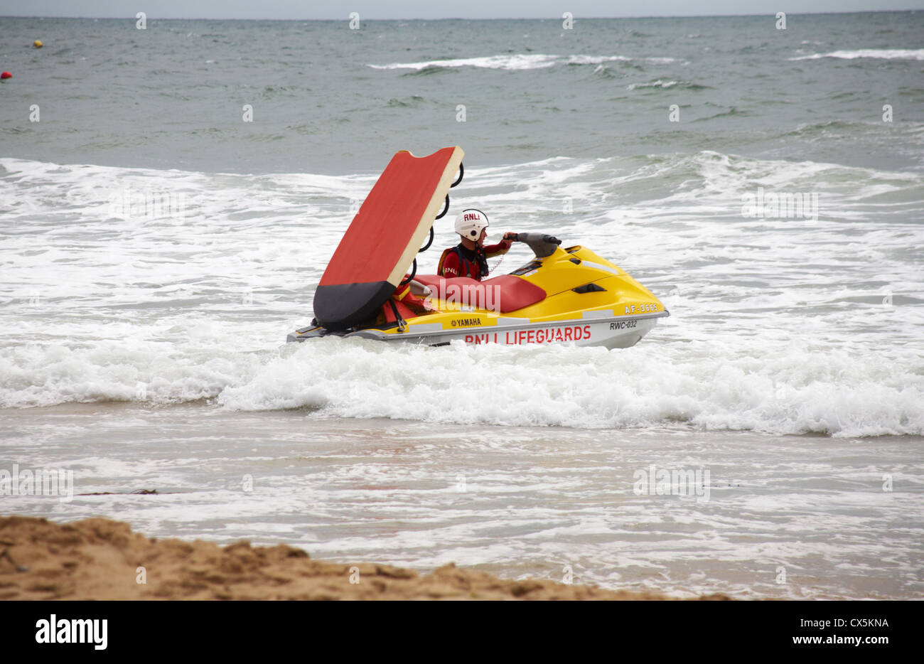 RNLI Lifeguards jetski with lifeguard in sea at Boscombe Bournemouth ...