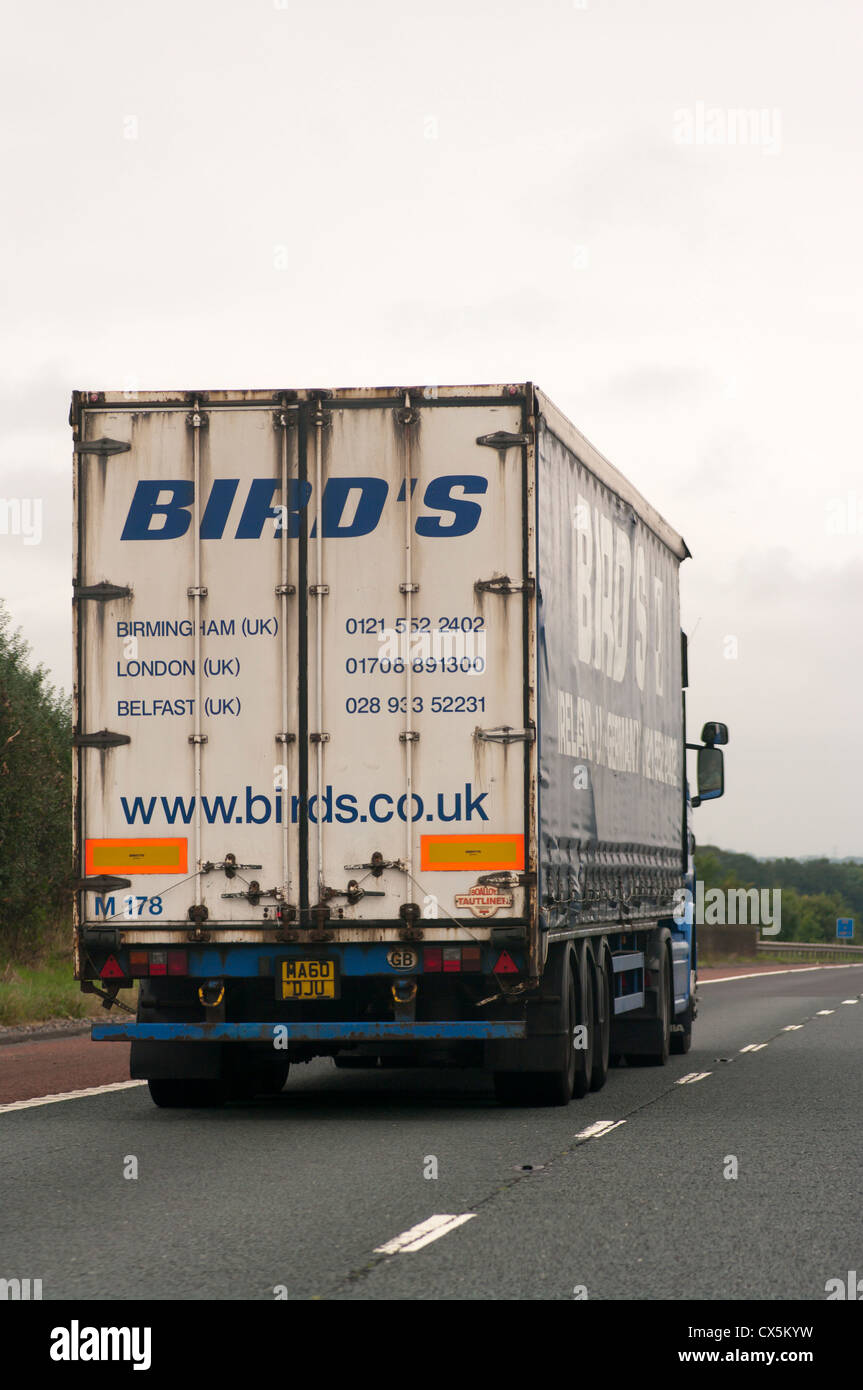 Rear View Of A Birds Articulated Lorry In Motion On A Road Stock Photo ...